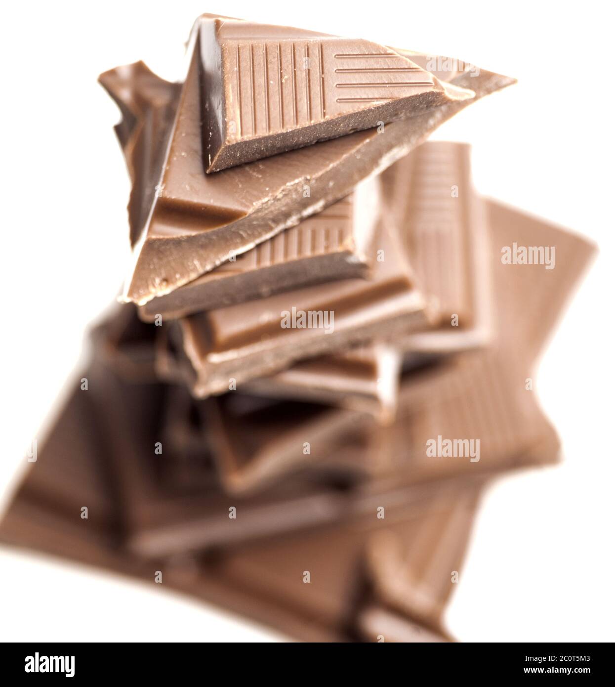 Chocolate pieces on white background Stock Photo - Alamy