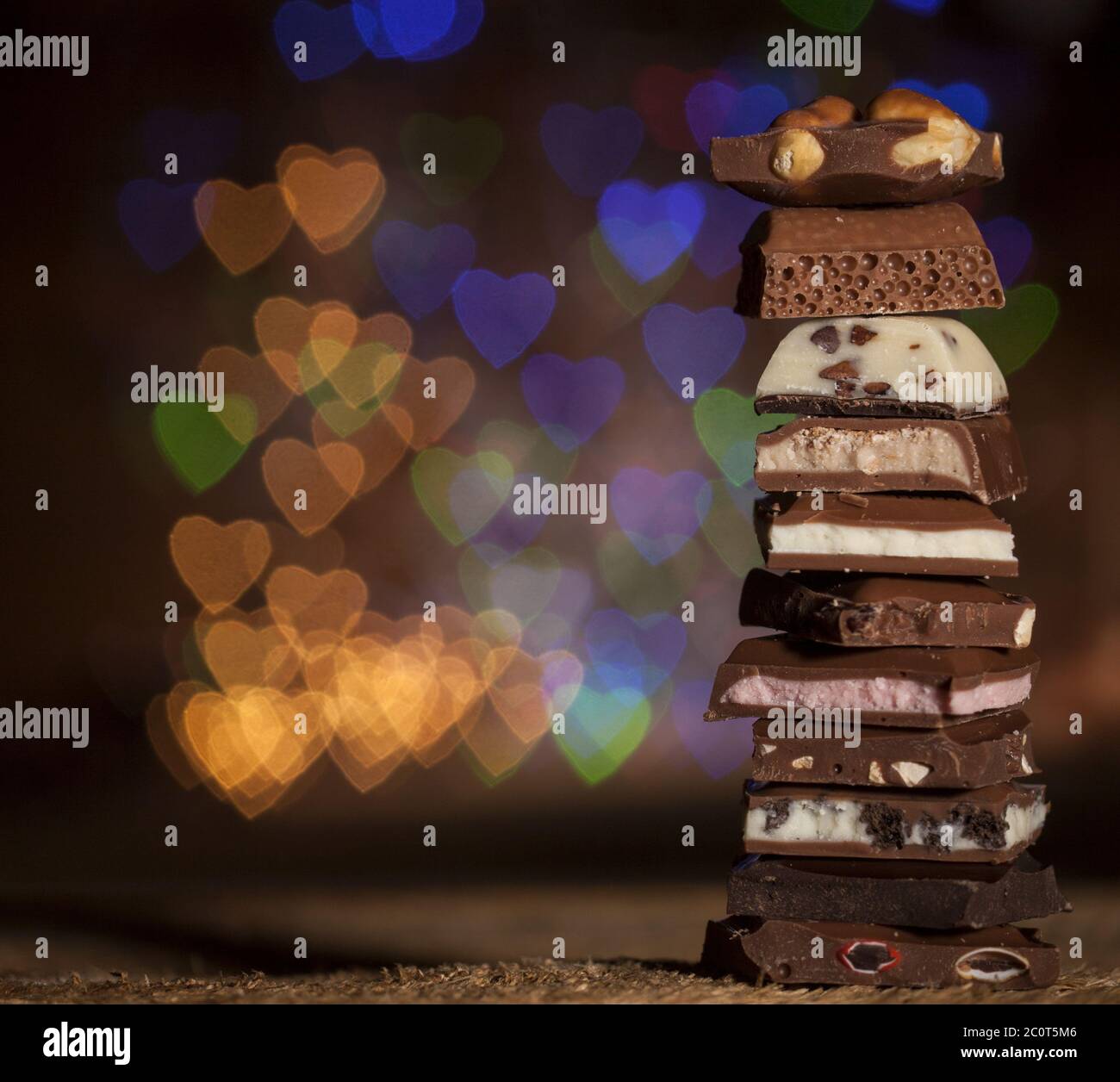 Chocolate stack on colorful bokeh background Stock Photo - Alamy