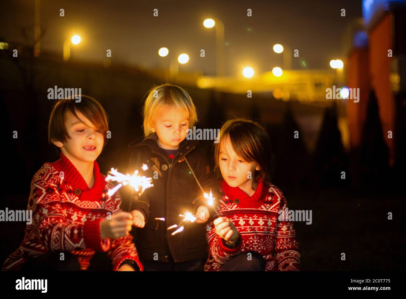 Children lighting fireworks hi-res stock photography and images - Alamy