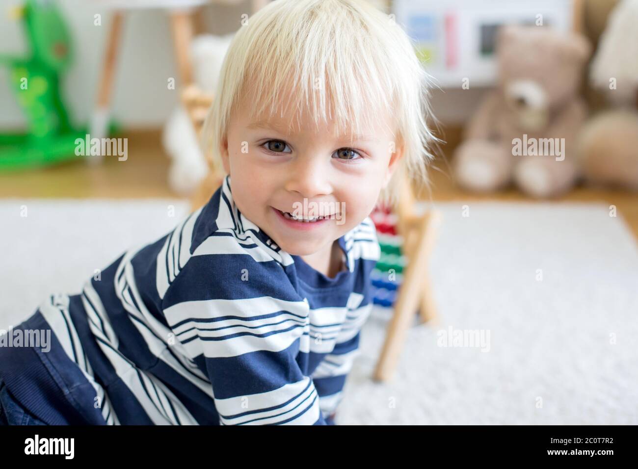 Cute toddler boy, playing with counter, colorful abacus, child learning ...