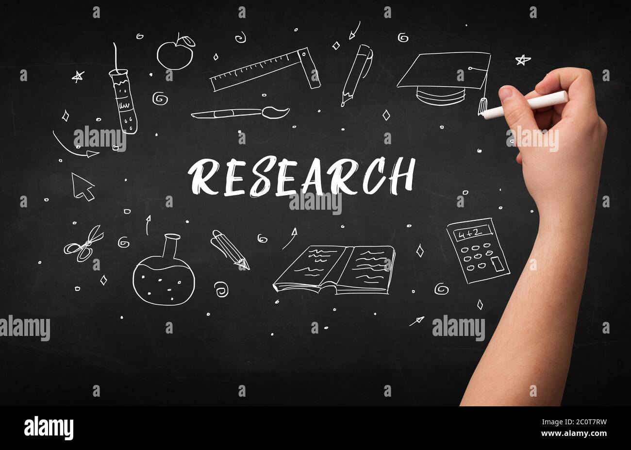 Hand drawing RESEARCH inscription with white chalk on blackboard ...