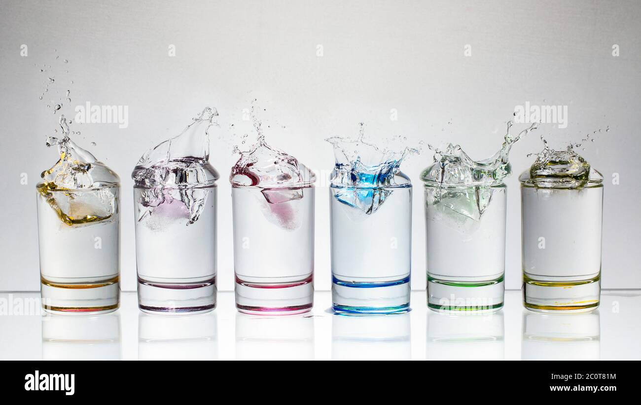 water splash in glasses isolated on white Stock Photo - Alamy