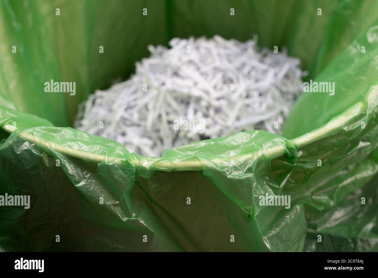 A detail of shredded domestic documents and paperwork in a waste paper ...