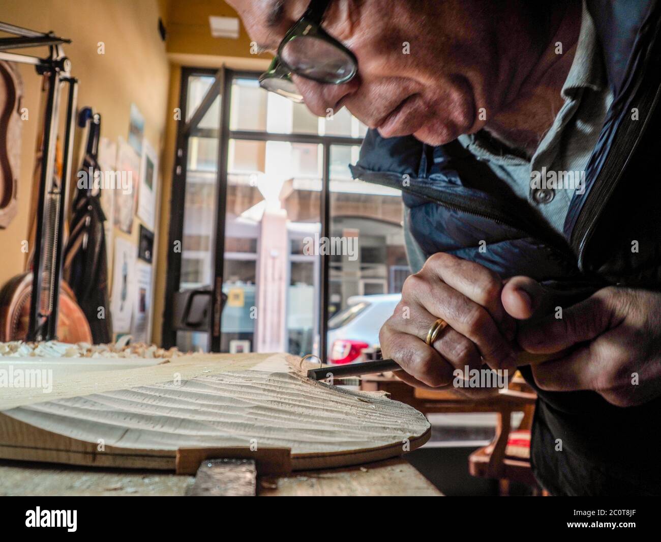 Professional luthier violinmaker artisan Robert Gasser working on ...