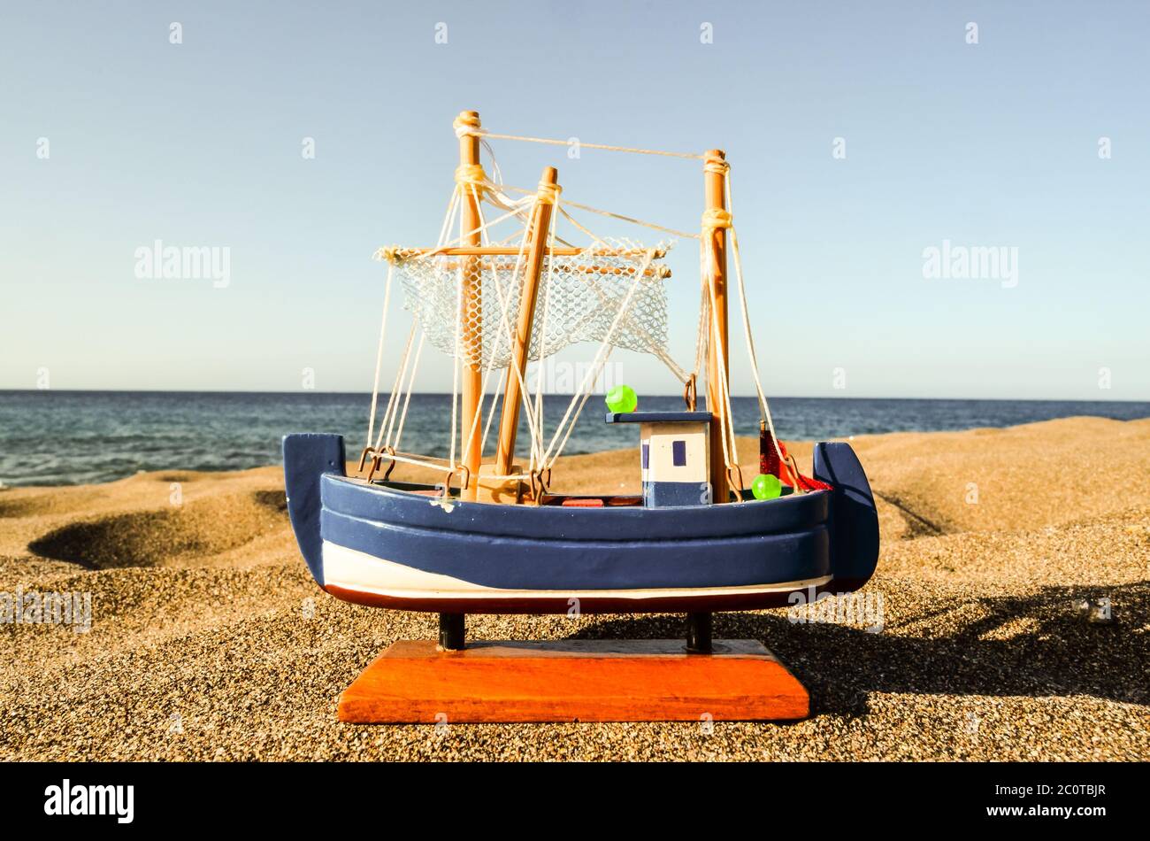Toy Boat on the Sand Beach Stock Photo - Alamy