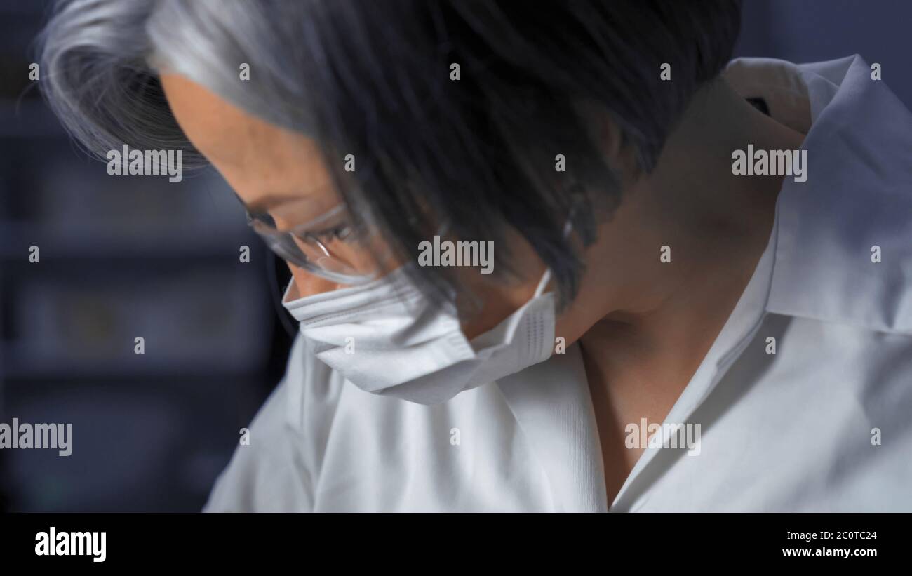 Overworked doctor exhausted by workload. Profile view of mature woman ...