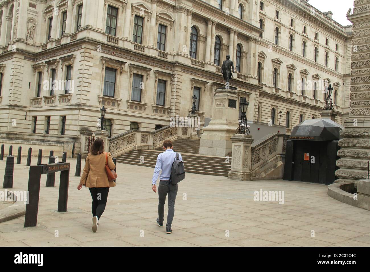 A couple walk towards the statue of Clive. Robert Clive, the 1st Baron ...