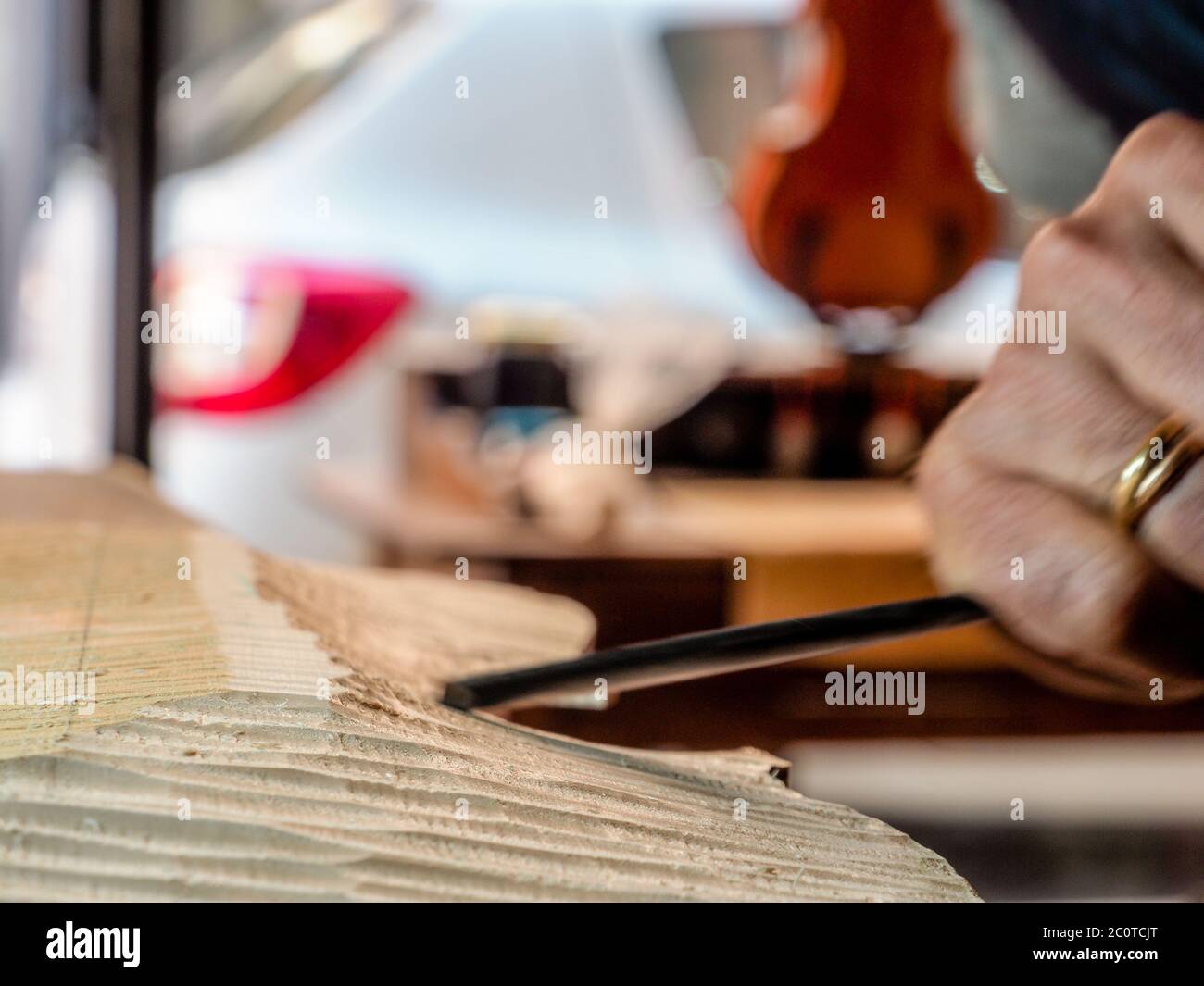 Professional luthier violinmaker artisan Robert Gasser working on ...