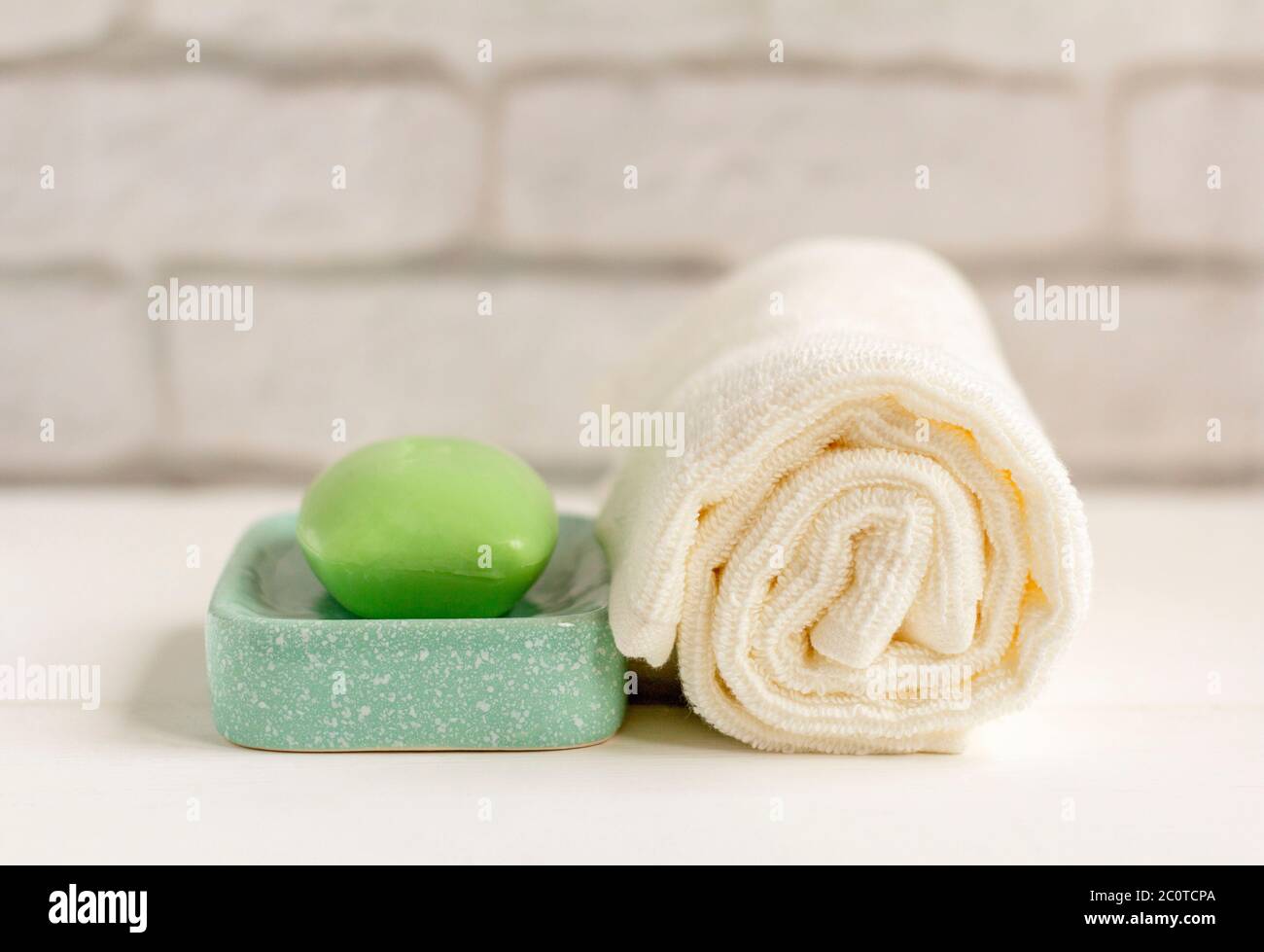 White Terry towels and soap on a light background Stock Photo - Alamy