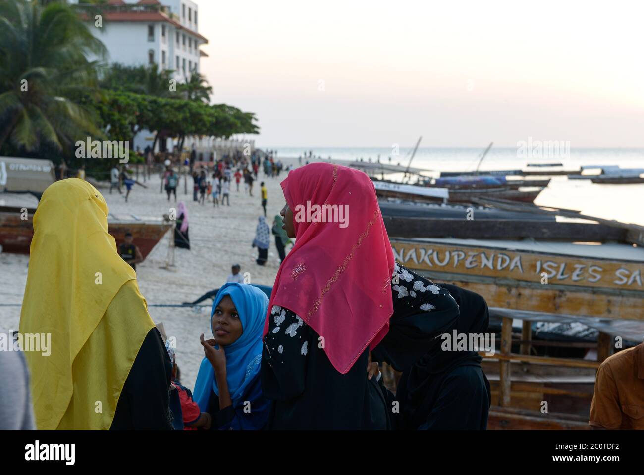 TANZANIA, Zanzibar, Stone town, muslim women at seafront Stock Photo ...