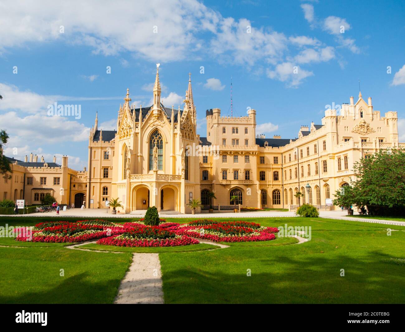 Lednice Chateau in the English Neo-Gothic style with flower garden on ...