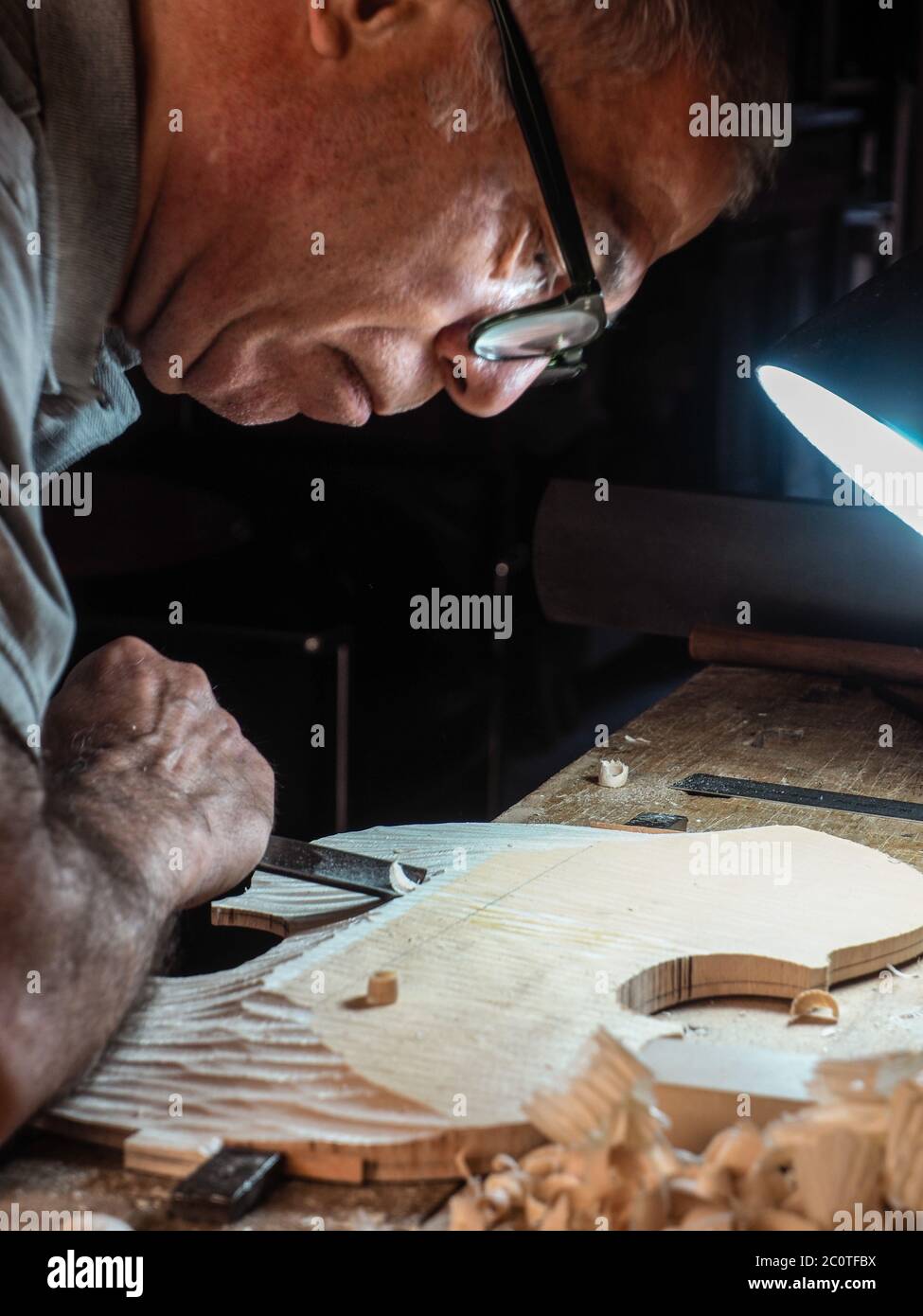 Professional luthier violinmaker artisan Robert Gasser working on ...