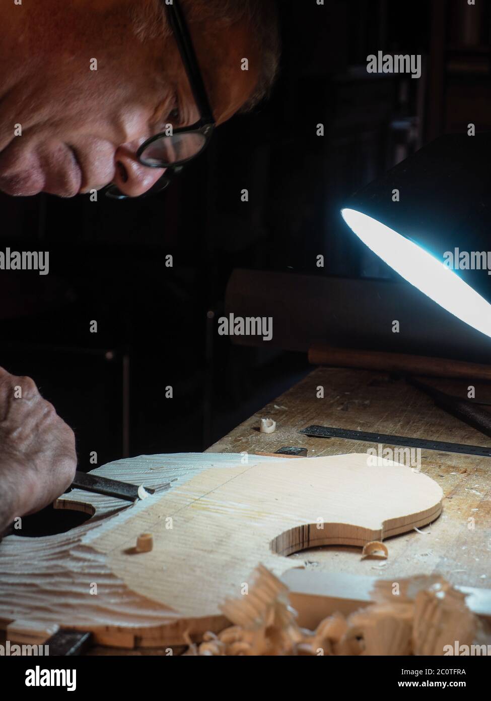 Professional luthier violinmaker artisan Robert Gasser working on ...