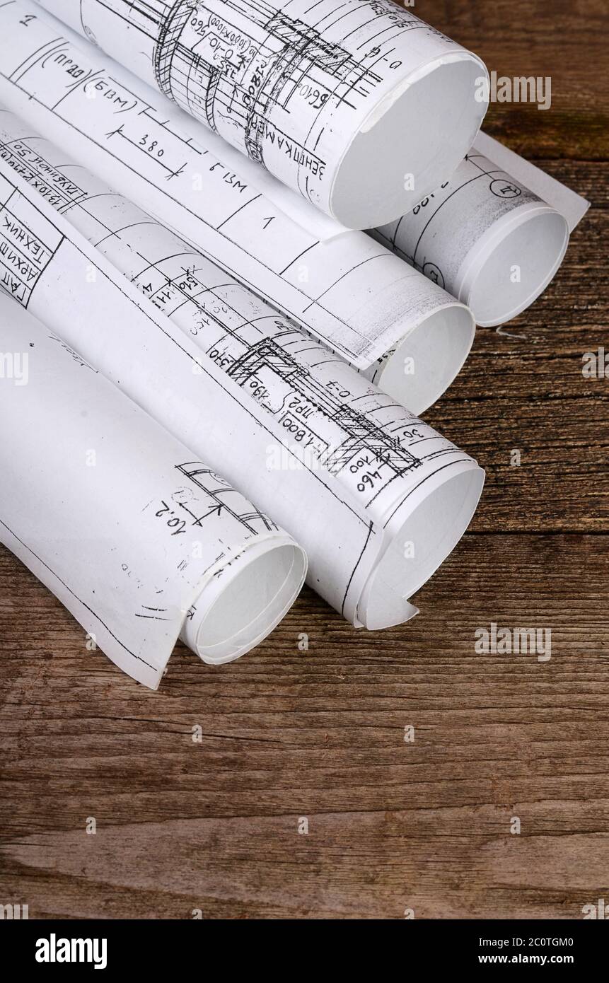 Projects of houses on wooden background Stock Photo - Alamy