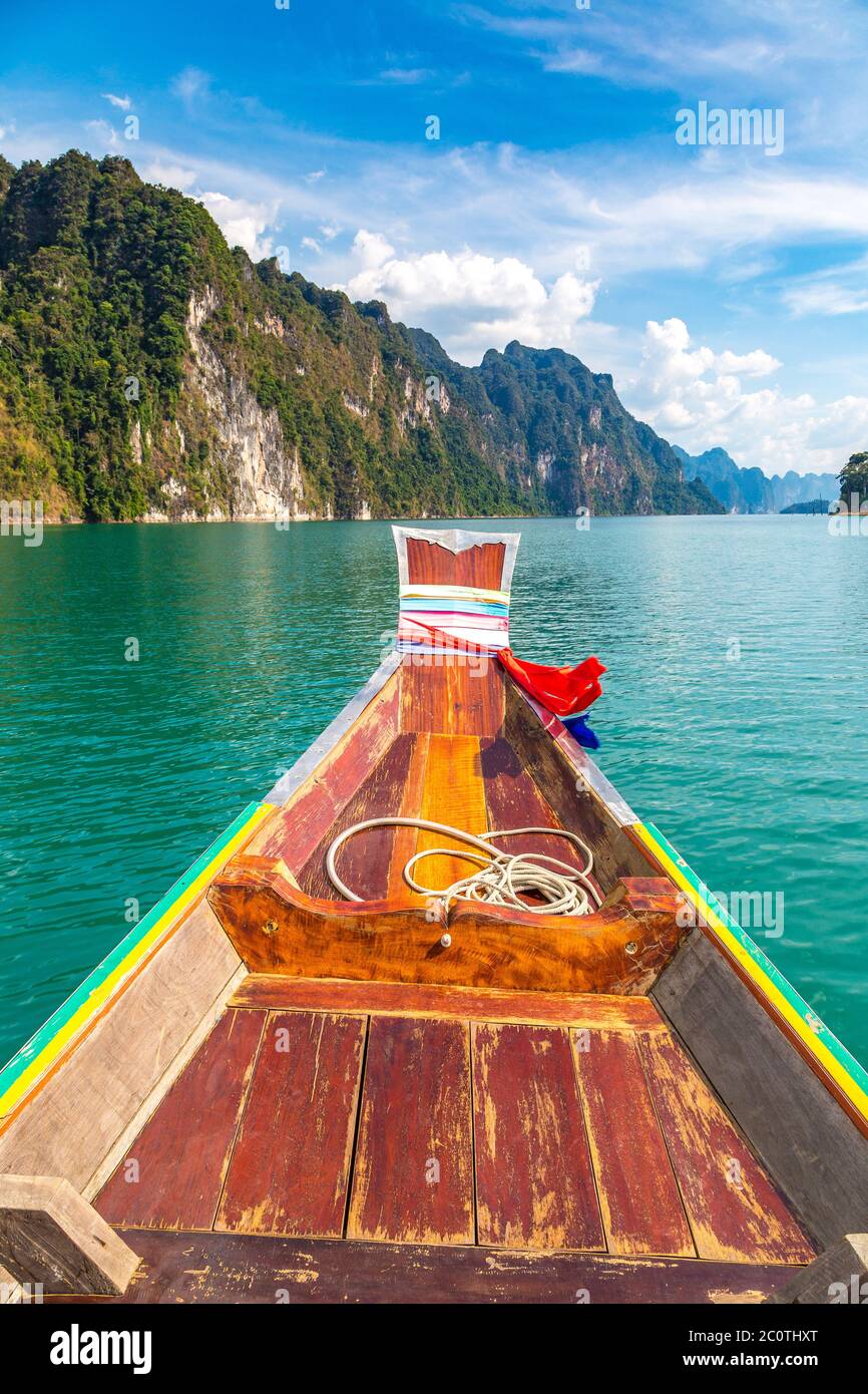 Wooden thai traditional long tail boat on Cheow Lan lake, Ratchaprapha ...