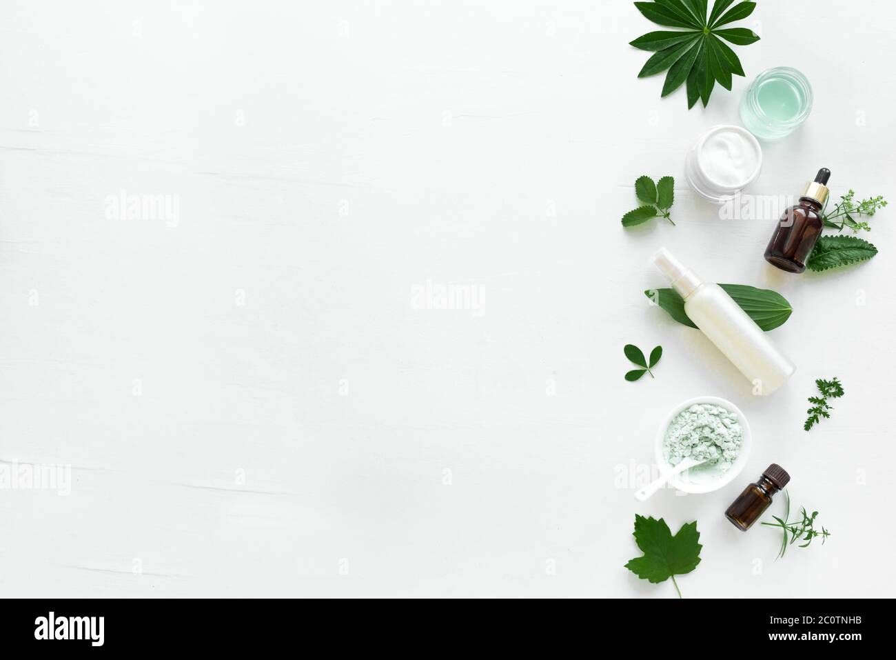 Natural Cosmetic Products And Green Leaves On White Background Top