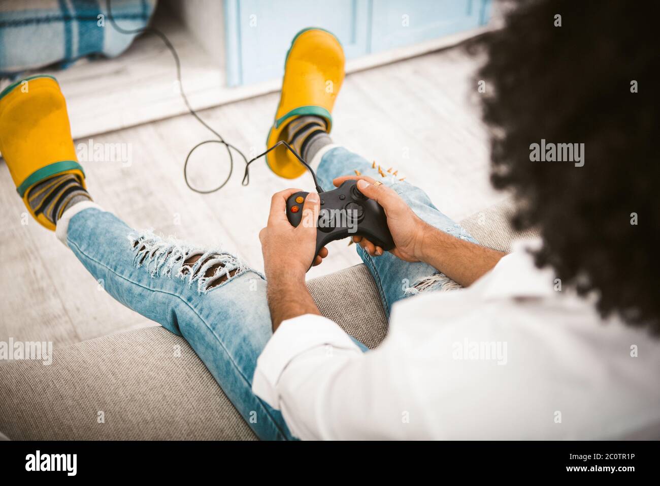Gamer playing video games. Selective focus on male hands hands pushing ...