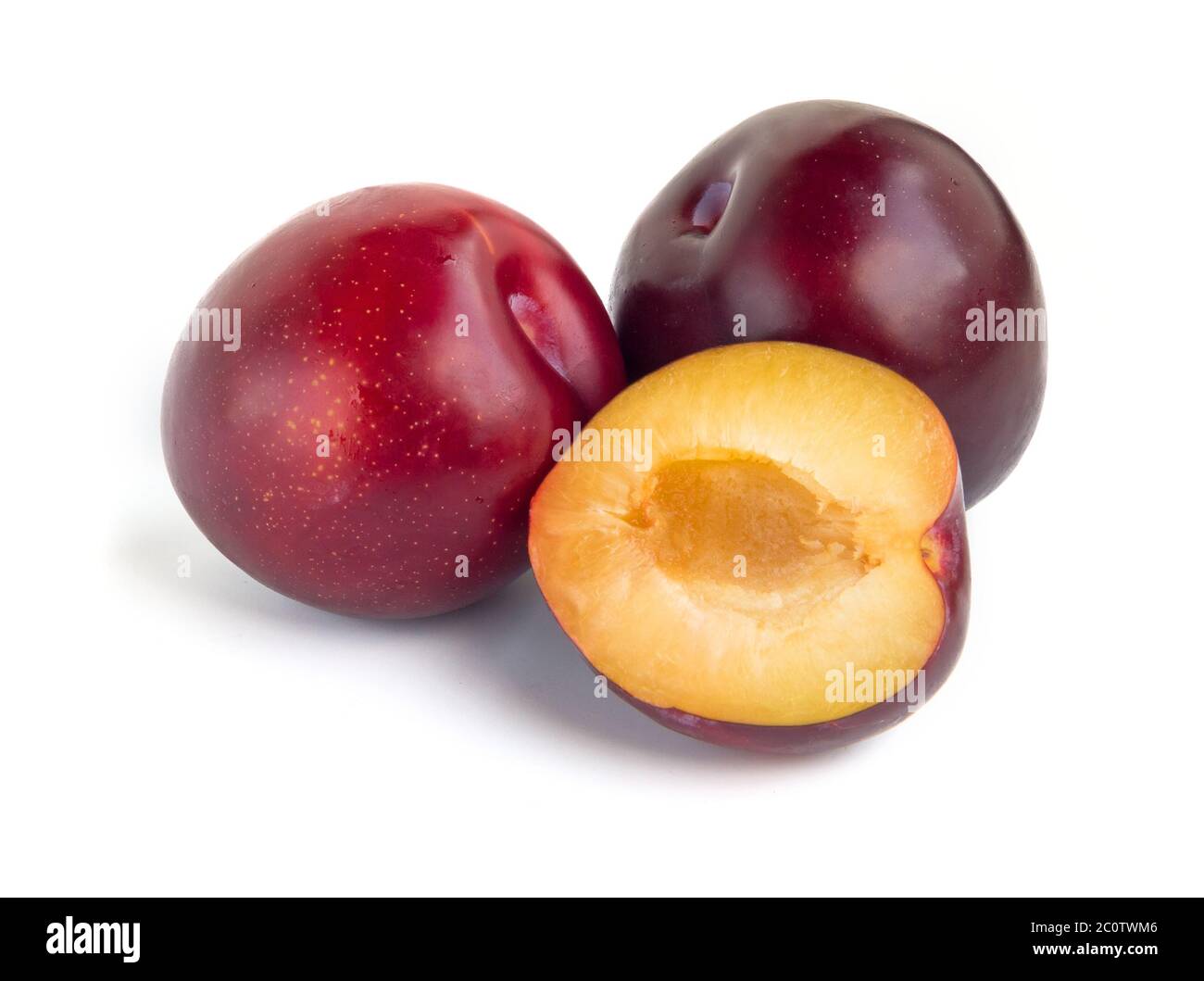 Three plums isolated on white background Stock Photo - Alamy