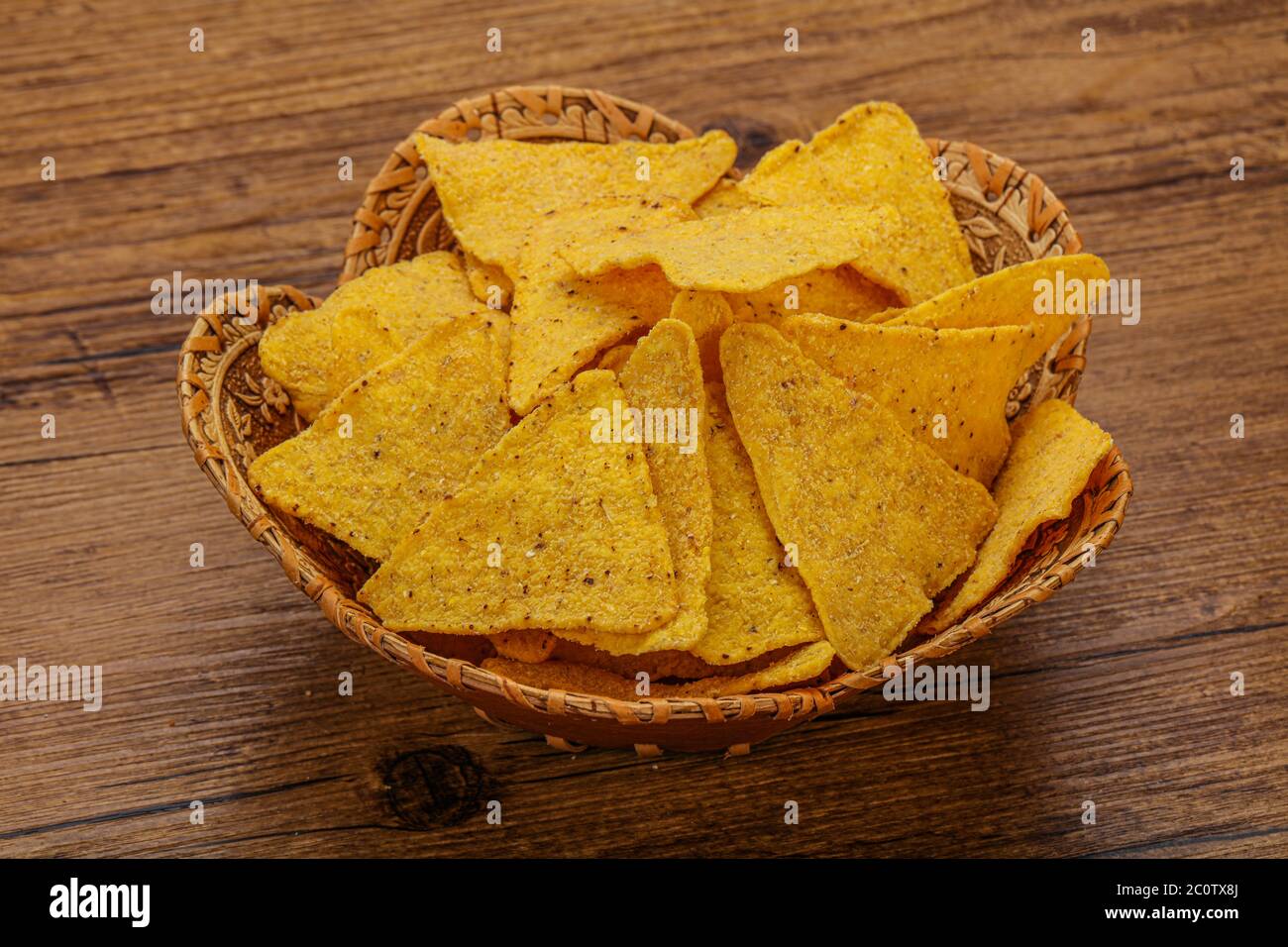 Mexican crunchy corn nachos triangle heap Stock Photo - Alamy