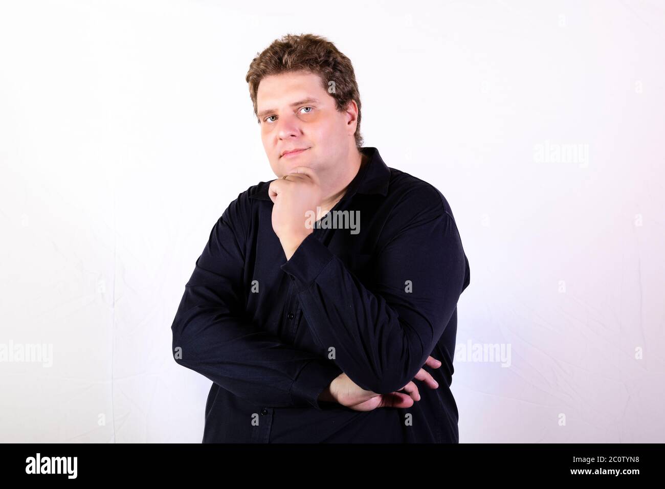 Plus size man in studio photos with white background Stock Photo - Alamy