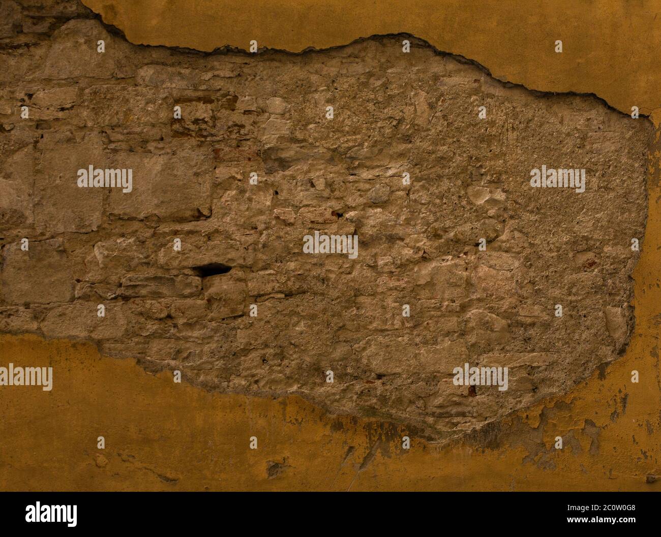 Old brick or stone wall with fallen stucco. Grunge texture of antique ...