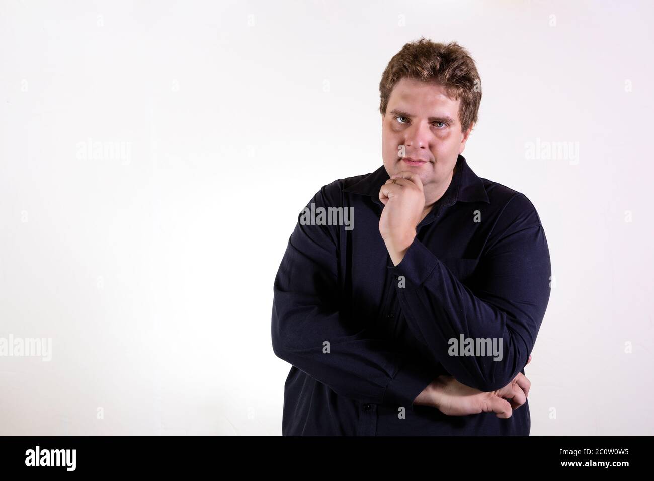 Plus size man in studio photos with white background Stock Photo - Alamy