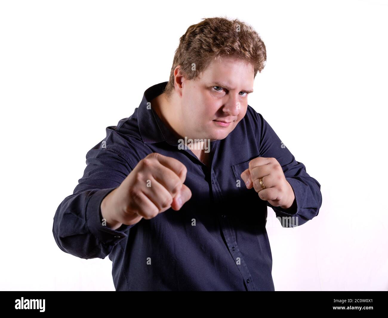 Blond man doing boxing fighter position isolated on white background ...
