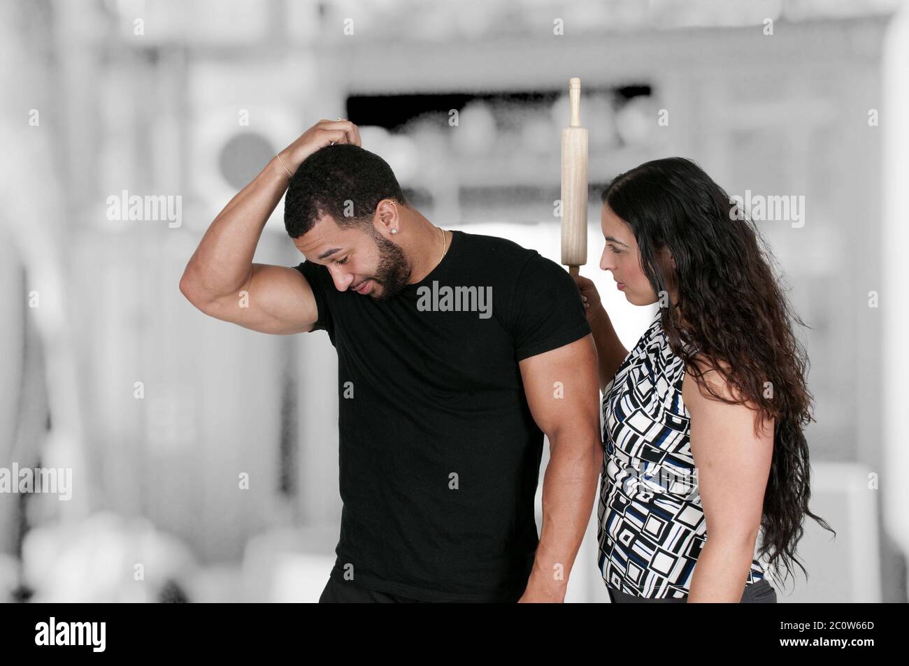 Woman Chasing man with Rolling Pin Stock Photo - Alamy