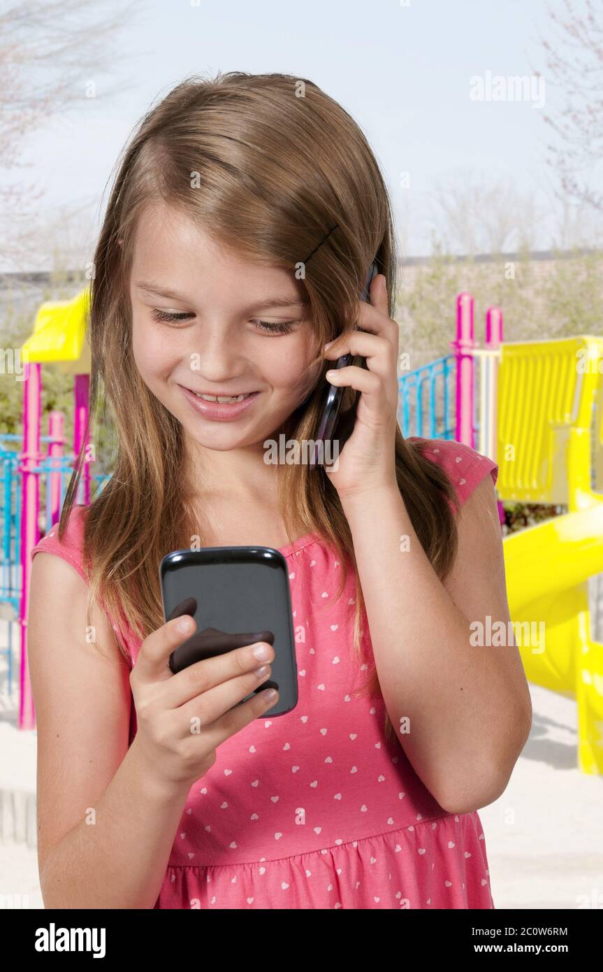 Little Girl Using Cell Phones Stock Photo - Alamy
