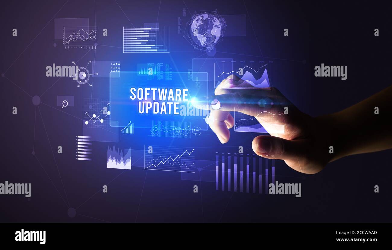 Hand touching SOFTWARE UPDATE inscription, new business technology ...