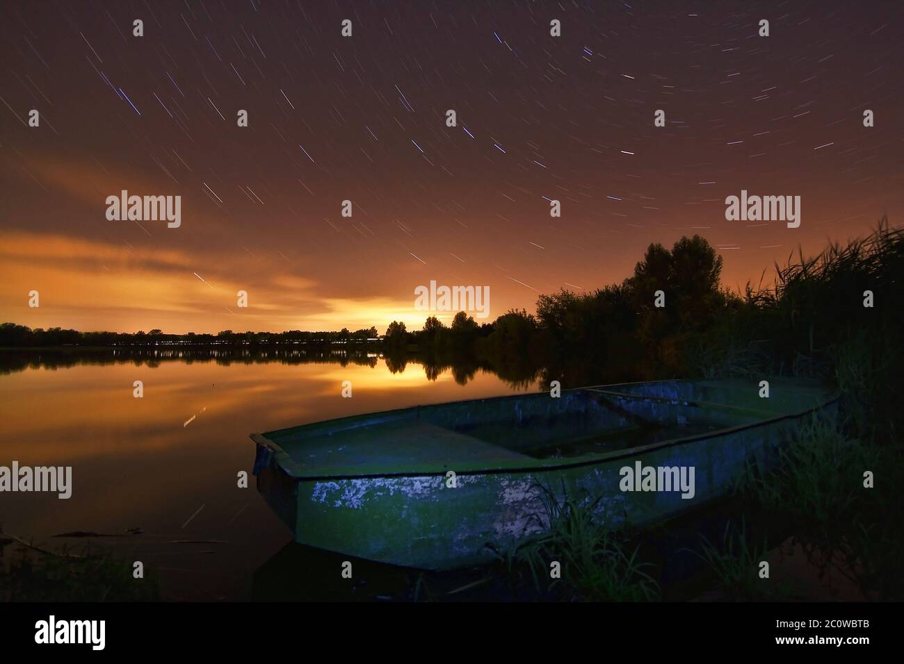 Rowing boat on lake at night hi-res stock photography and images - Alamy