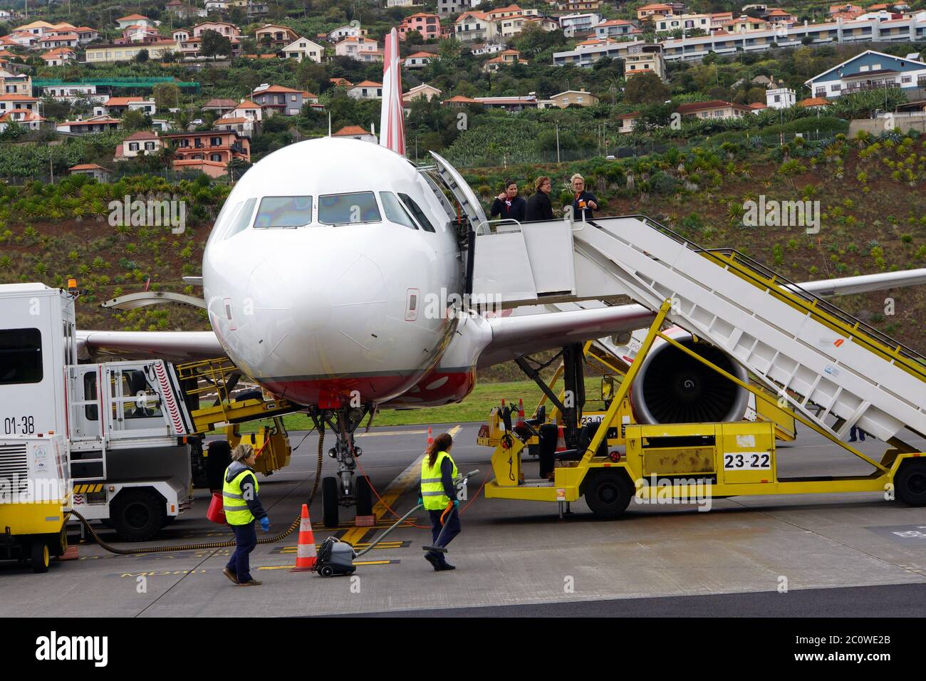 Landed aircraft is serviced Stock Photo - Alamy