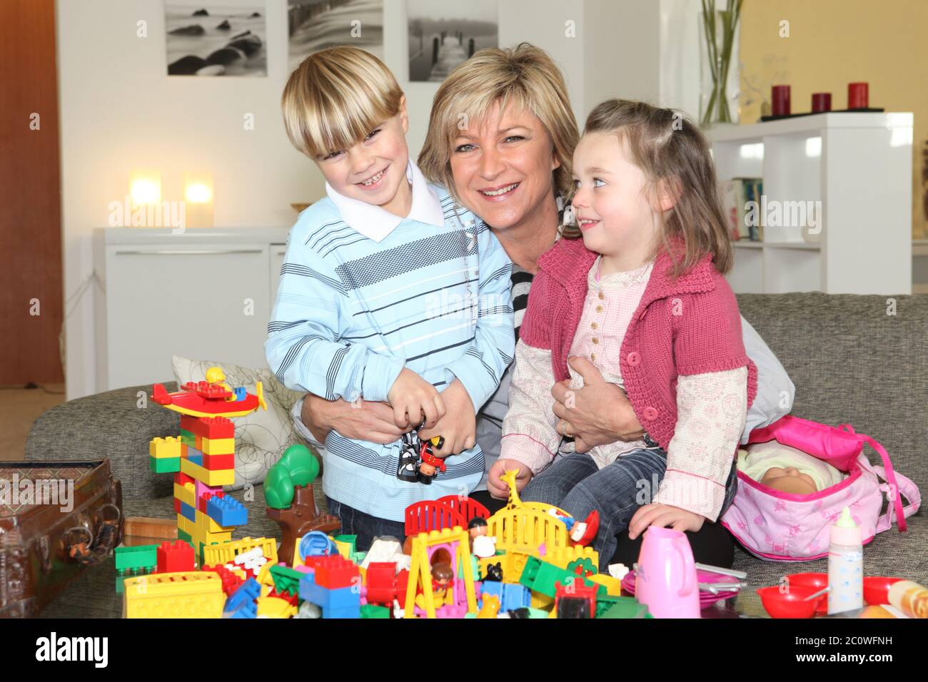 Brother sister playing doll blocks hi-res stock photography and images ...