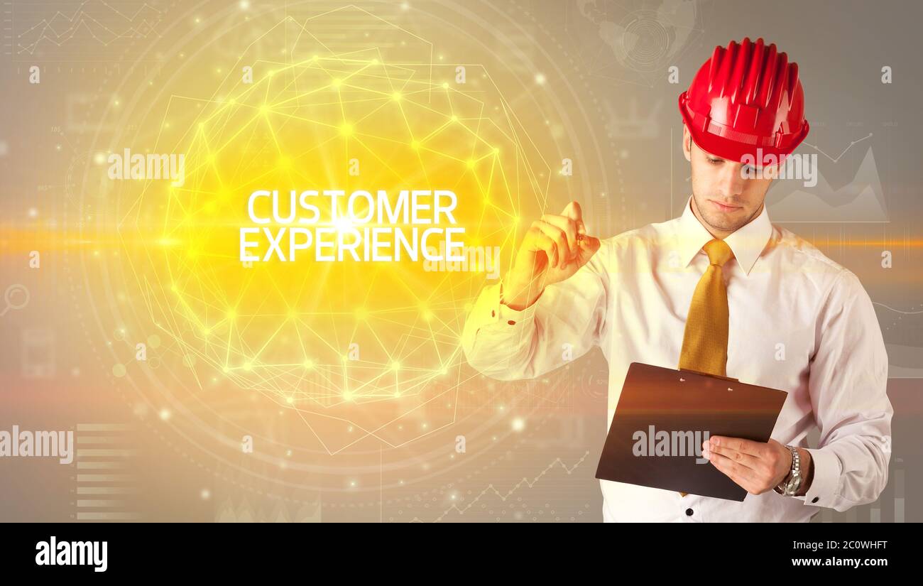 Handsome businessman with helmet drawing CUSTOMER EXPERIENCE ...