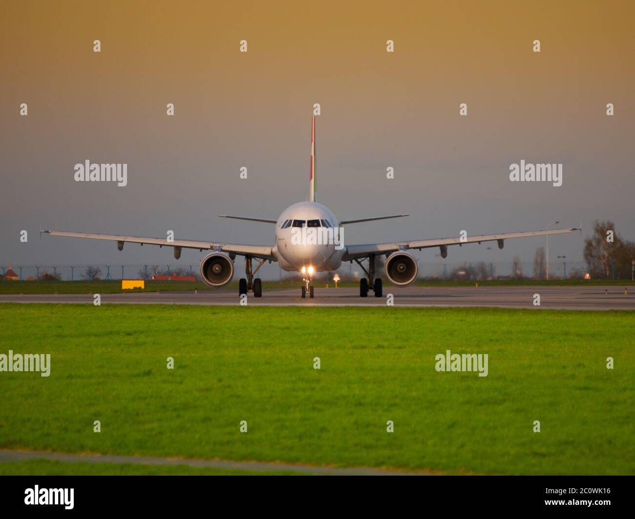 Plane with on the airport runway, front view Stock Photo - Alamy