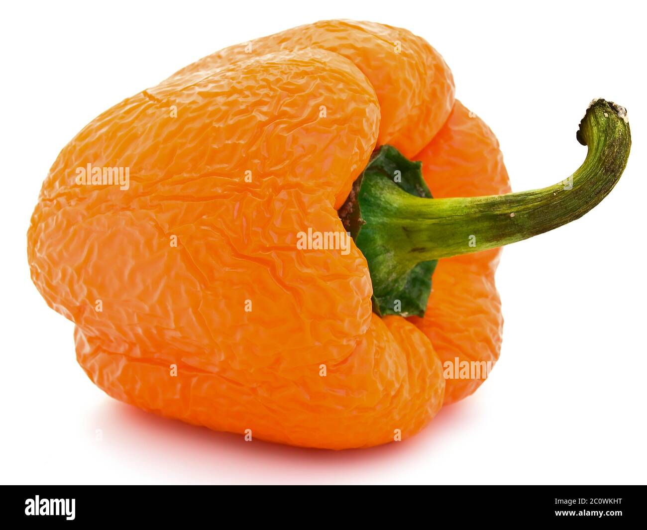 old wrinkled orange paprika Stock Photo - Alamy