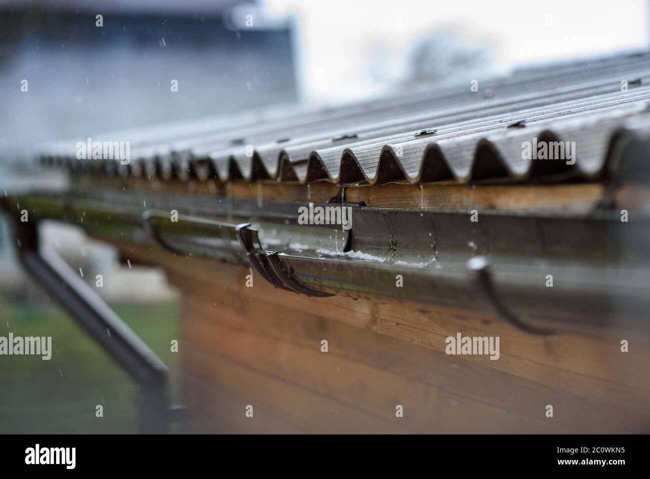 rain flows down from the roof Stock Photo - Alamy