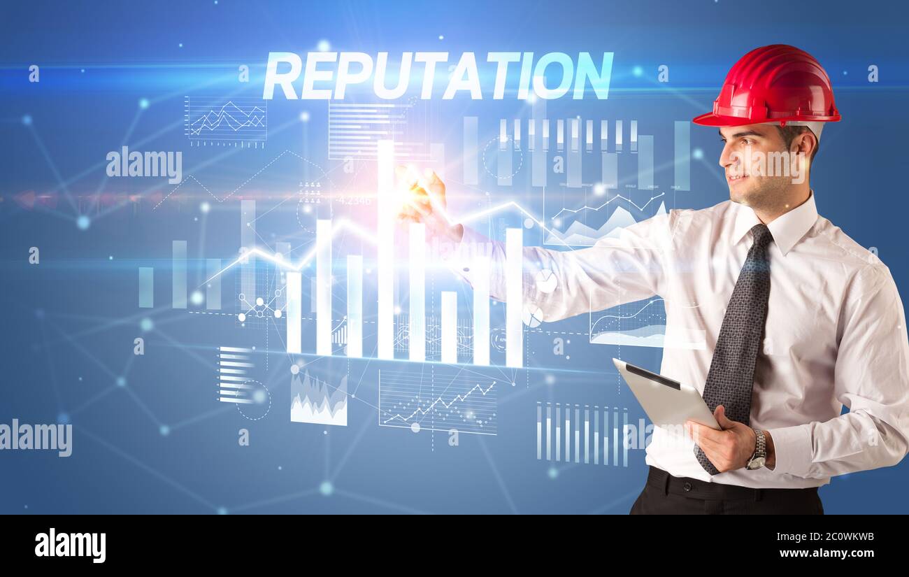 Handsome businessman with helmet drawing REPUTATION inscription ...