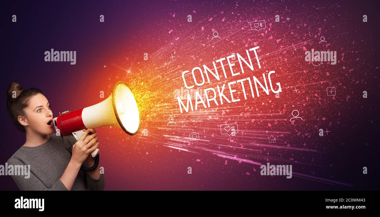 Young woman yelling to loudspeaker with CONTENT MARKETING inscription ...