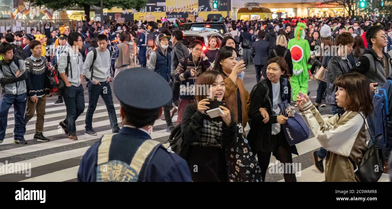 Huge crowd of people in the street of Shibuya during Halloween night ...