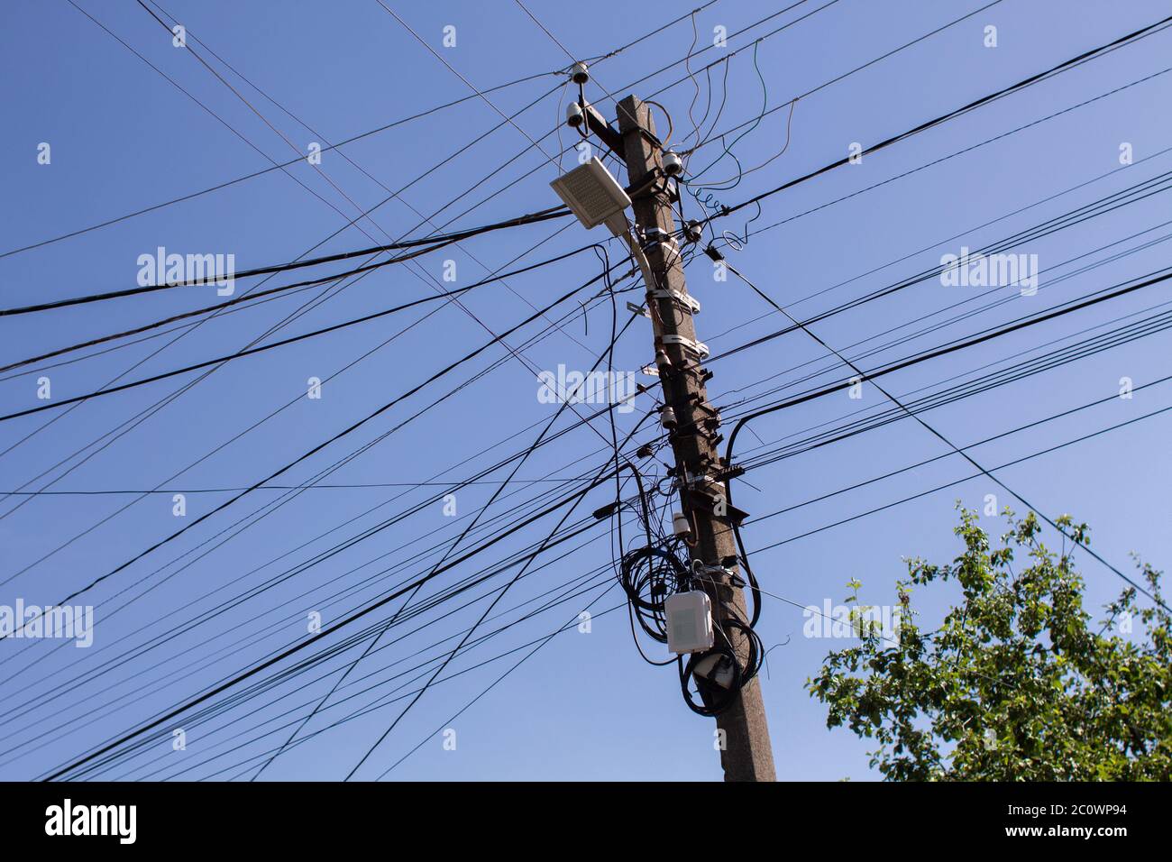 an electric wires on a pillar in a city Stock Photo - Alamy