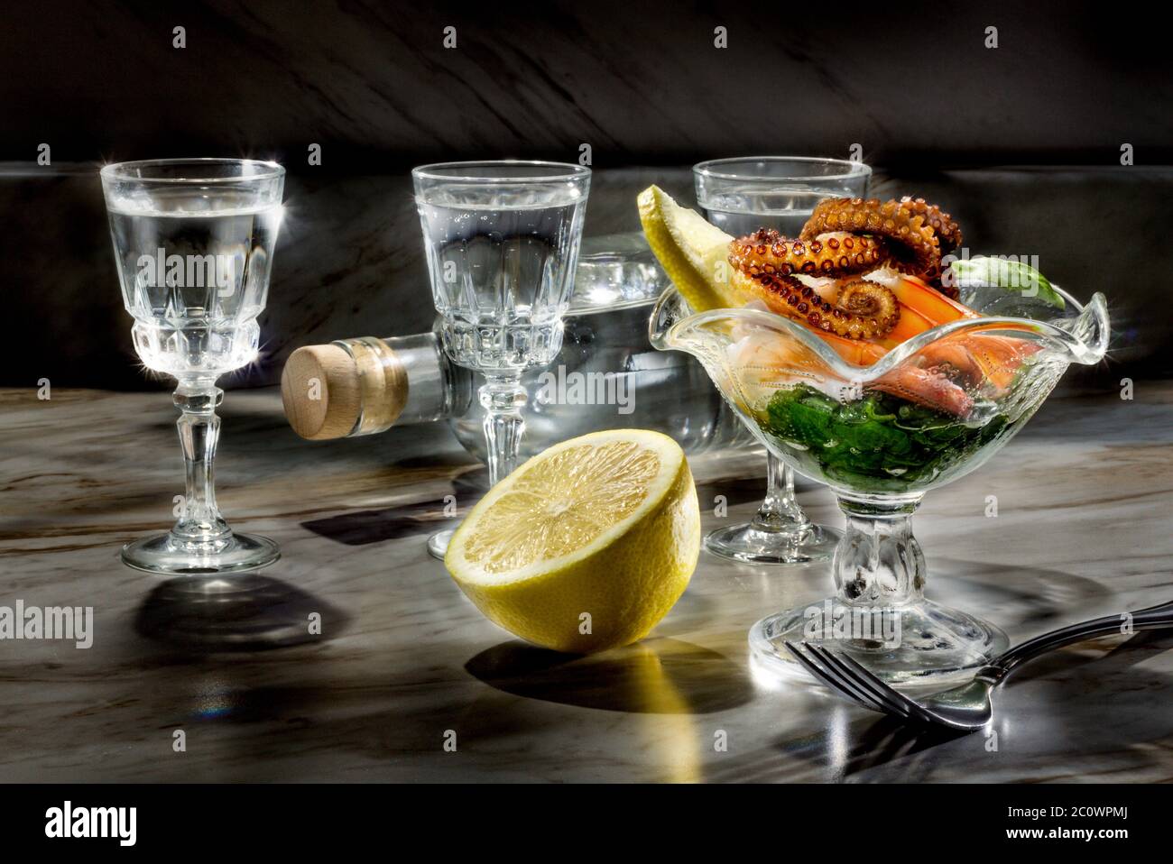 Shrimp and octopus tentacle cocktail appetizer with brunch vodka shots ...