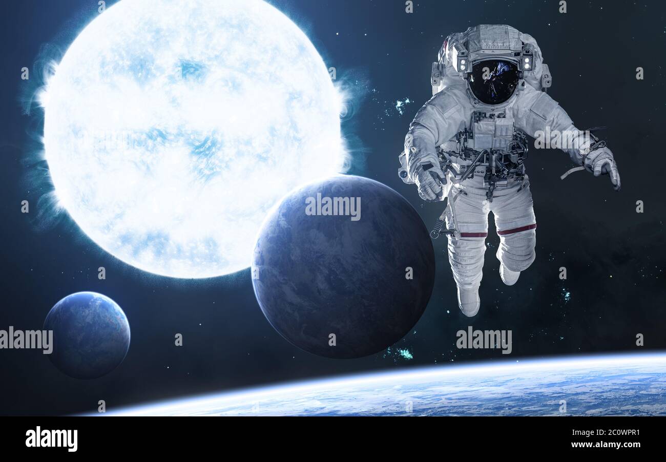 Blue giant star. Astronaut, planets in deep space Stock Photo - Alamy