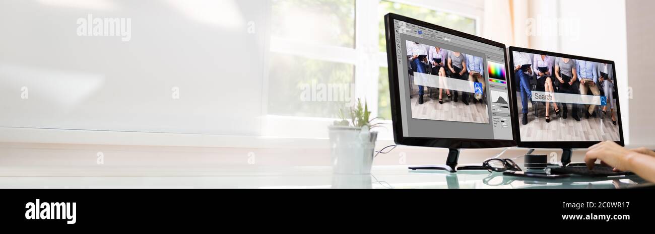 Graphic Designer Or Digital Artist Working On Multiple Computers Stock ...