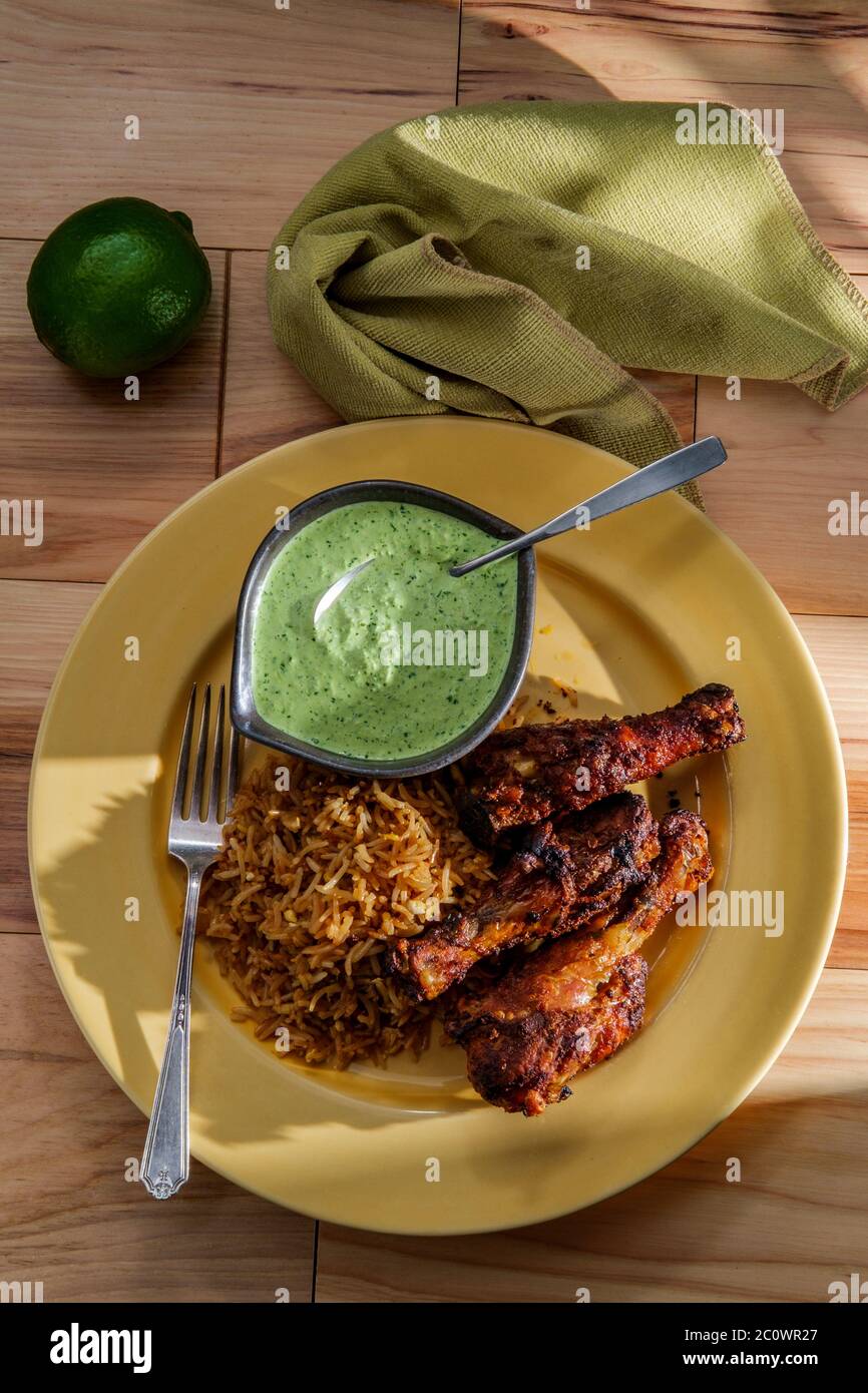 Peruvian chicken legs with aji verde green cilantro sauce and fried ...