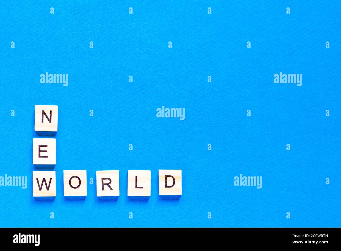 NEW WORLD word on wooden alphabet cube. New normal concept. flat layout ...