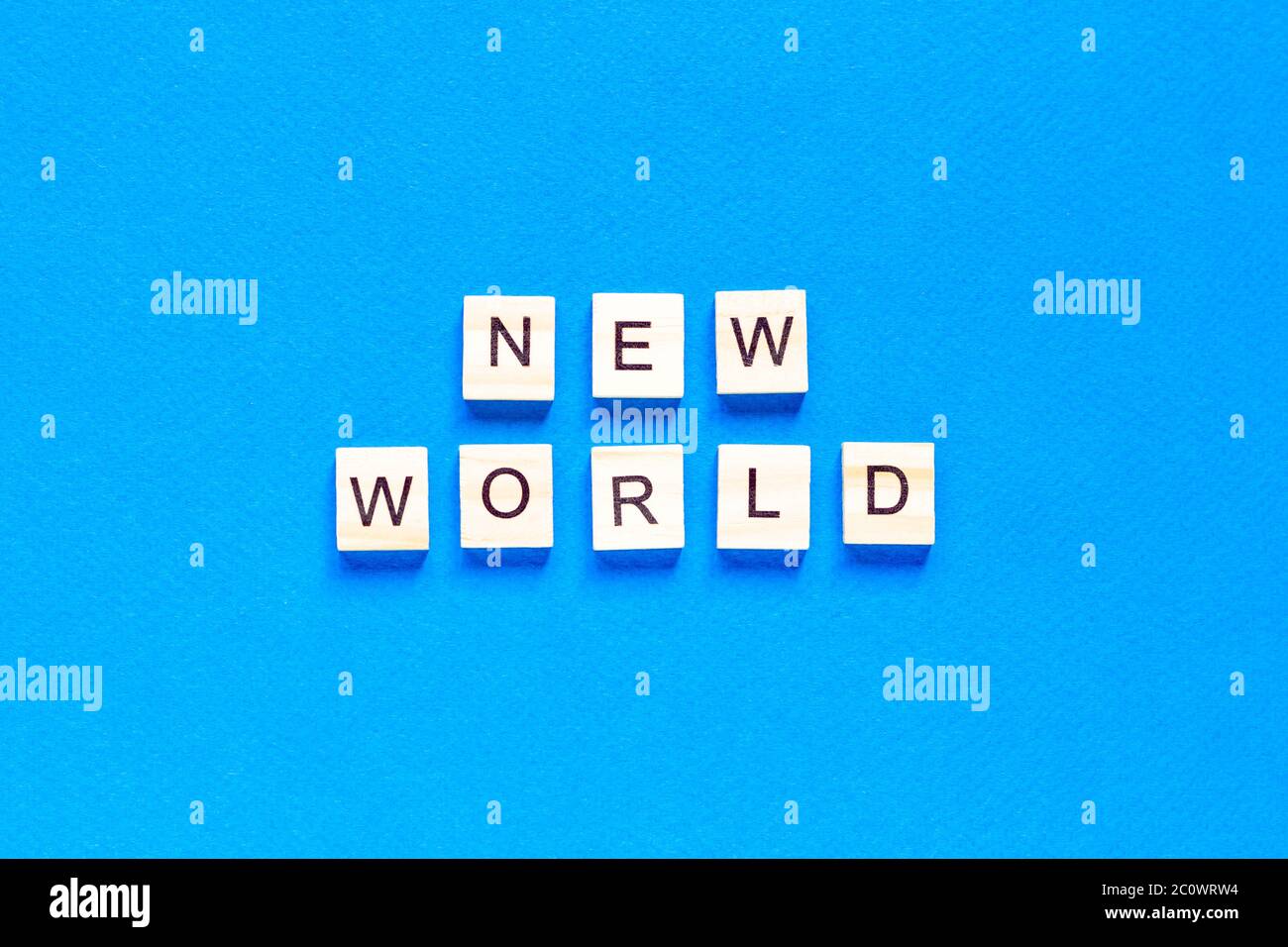 NEW WORLD word on wooden alphabet cube. New normal concept. flat layout ...