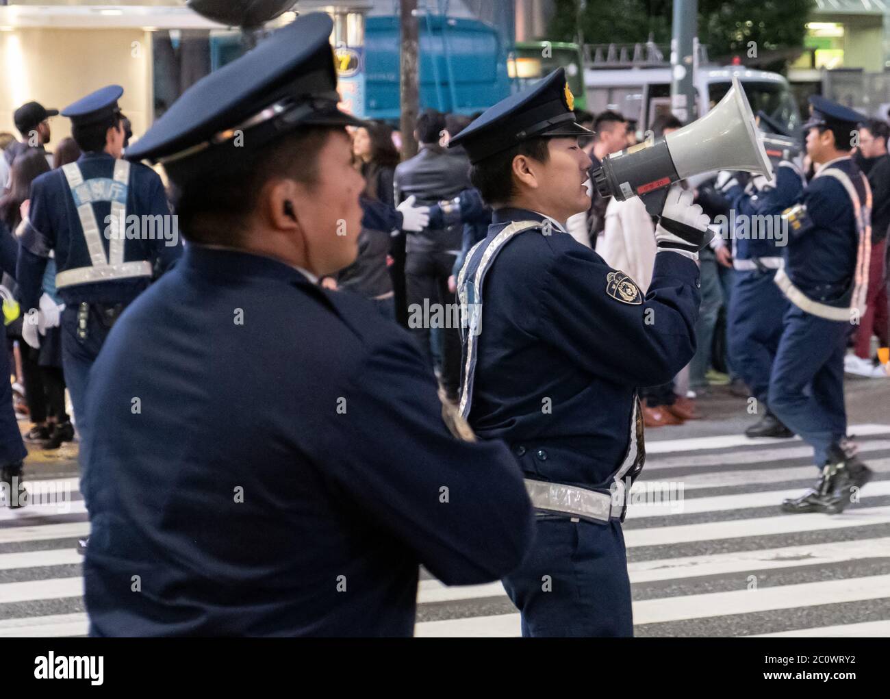 Tokyo police maintaining control and order in Shibuya during Halloween ...