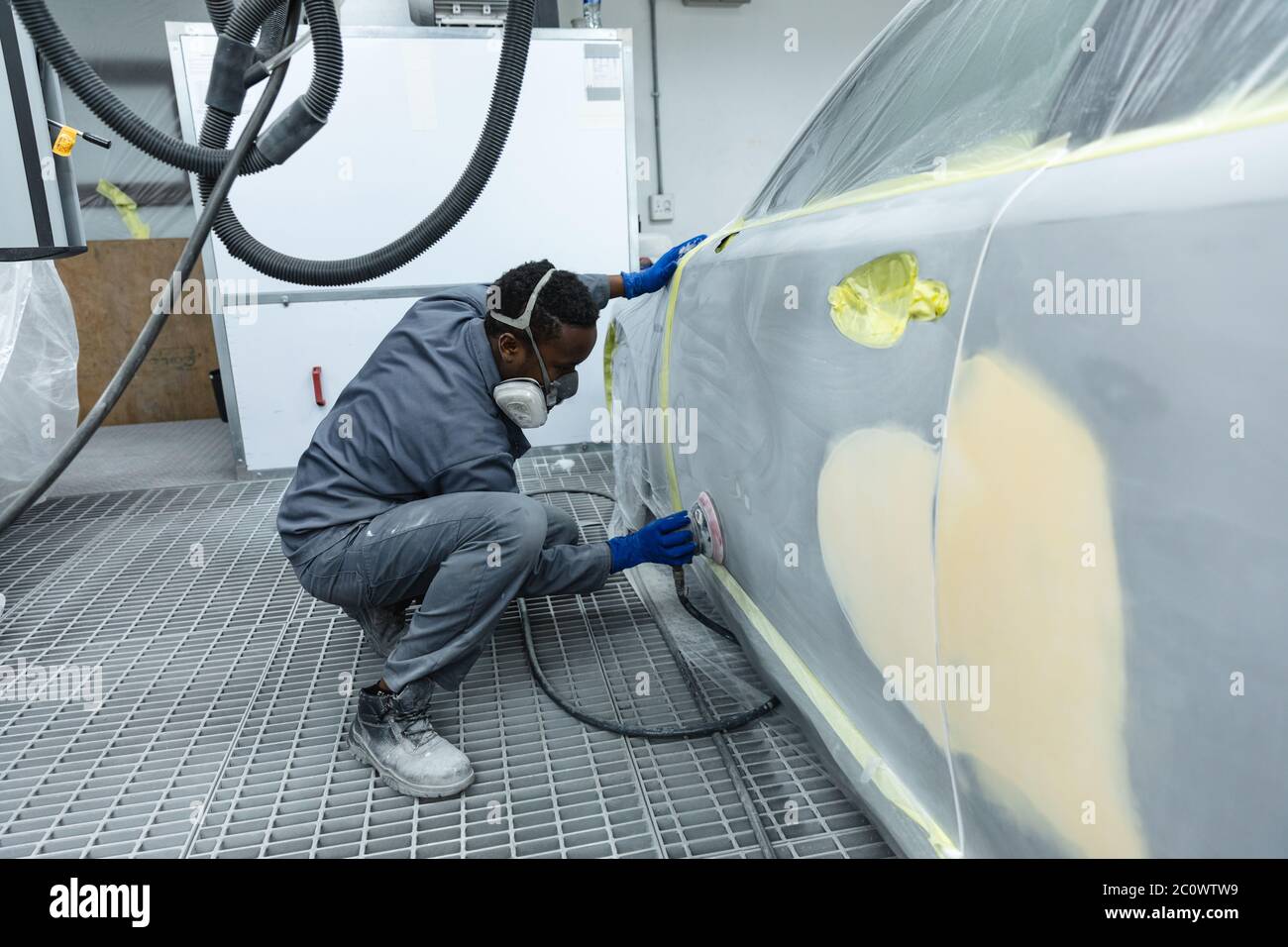 African American man car painter sanding a car Stock Photo - Alamy