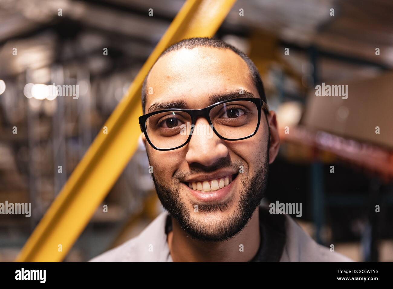 Portrait of a happy mixed race mechanic man Stock Photo - Alamy